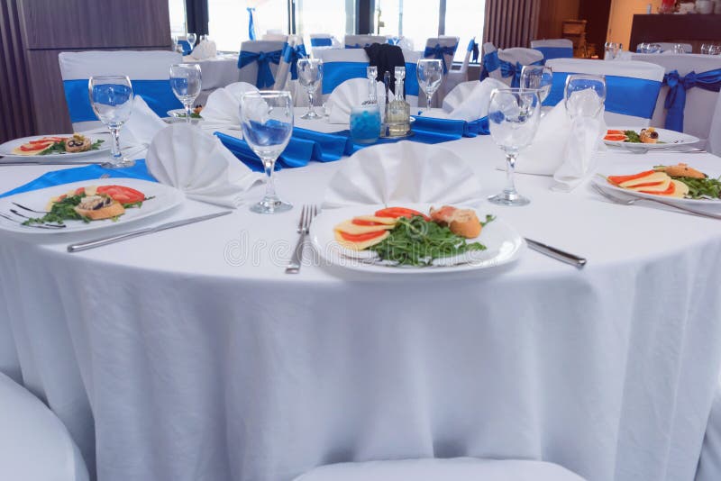 Tables and Chairs in the Restaurant with Food and Full Set Preparation ...