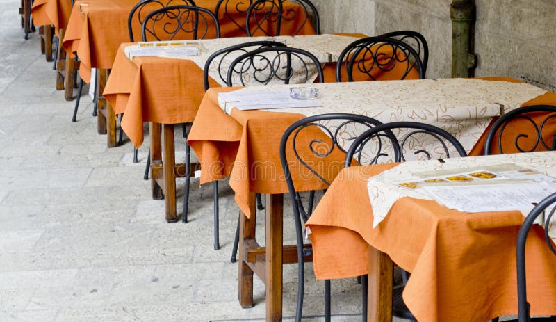 Tables are Covered with Orange Tablecloths in an Outdoor Cafe Stock ...