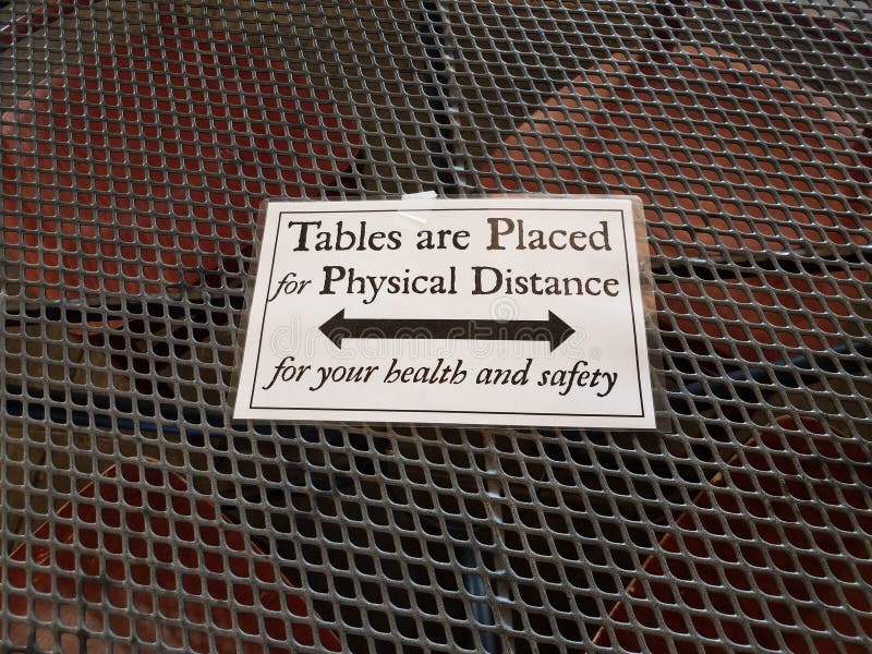 Tables are Placed for Physical Distance Sign Stock Photo - Image of ...