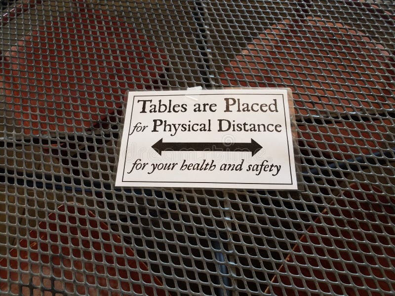 Tables are Placed for Physical Distance Sign Stock Image - Image of ...