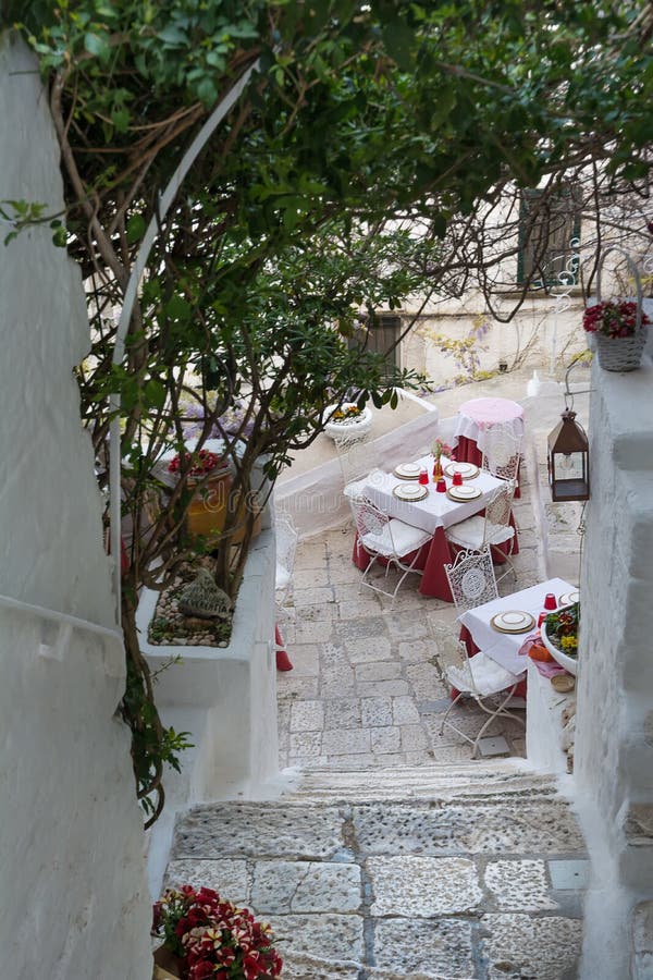 Tables of a Restaurant in an Alleyway in Ostuni Italy Stock Photo ...