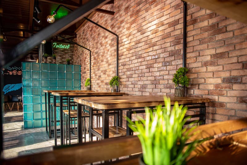 Tables in a Roadside Cafe with a Brick Interior Stock Photo - Image of ...