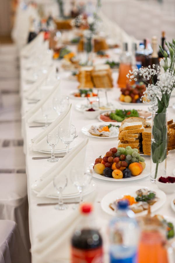 Tables Setting at a Luxury Wedding. Table for Guests. Dishes and Drinks ...
