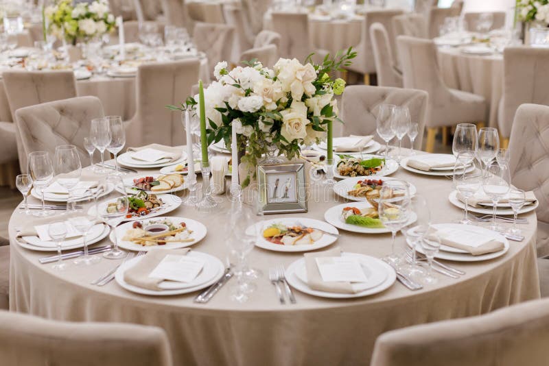 Tables Setting at a Luxury Wedding. Table for Guests. Dishes and Drinks ...