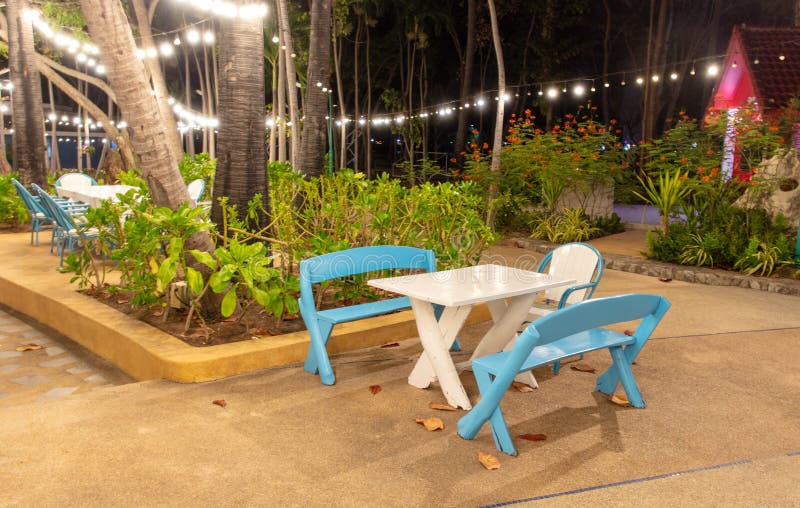 Tables in a Street Cafe in the Light of Lanterns at Night Stock Photo ...