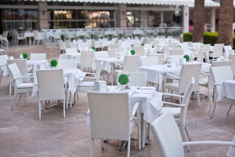 Tables in a summer cafe stock photo. Image of street - 70387450
