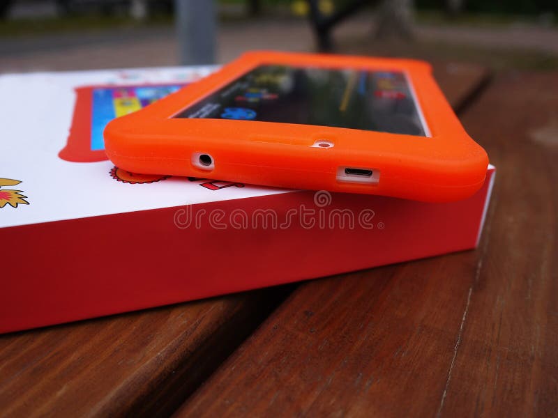 Tablet on the Android Platform for Children. Tablet with a Bright Cover ...