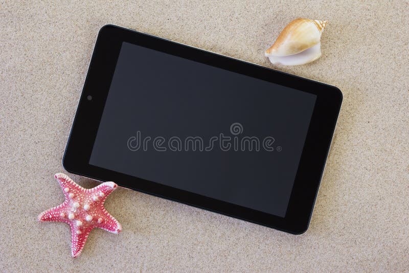 Tablet on the beach stock image. Image of reader, heat - 56748087