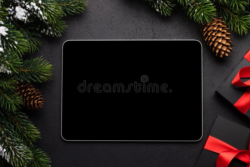 Tablet with Blank Screen, Gift Boxes and Christmas Decor Stock Photo ...