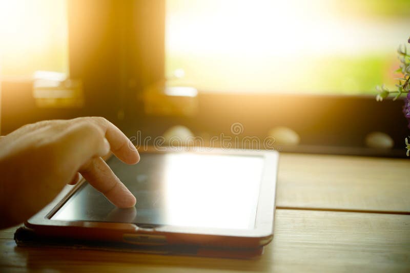 Tablet with a Blank Screen in the Hands on Wooden Table Stock Image ...
