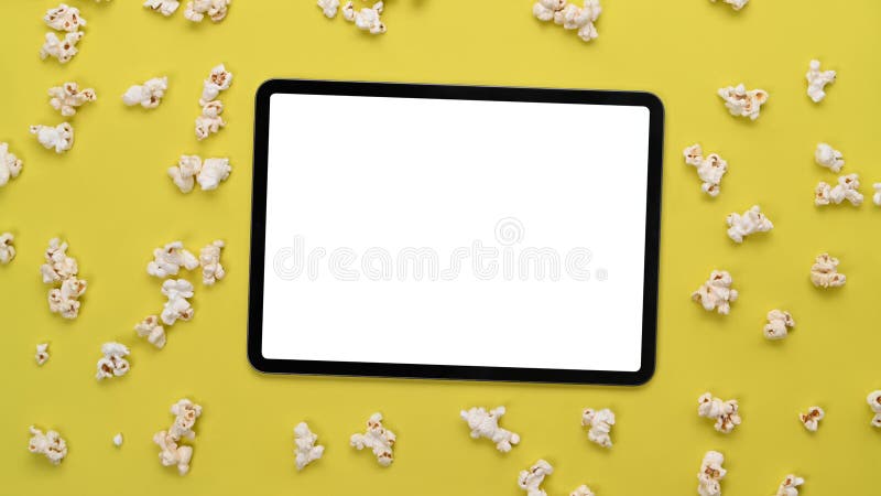 Digital Tablet Blank Screen with Popcorn on Yellow Background. Stock ...