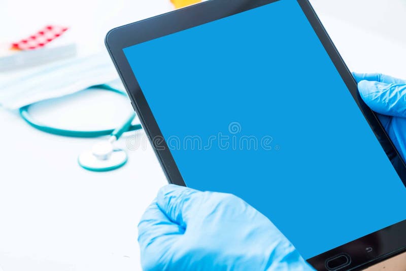 Tablet with a Blue Screen in the Hands of a Medical Doctor Stock Photo ...