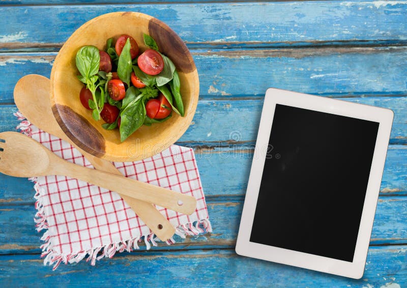 Tablet on Blue Wooden Desk with Food Stock Photo - Image of digital ...
