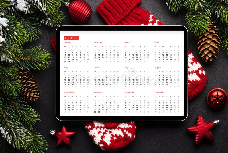 Tablet with Calendar and Christmas Decor Stock Image - Image of ...