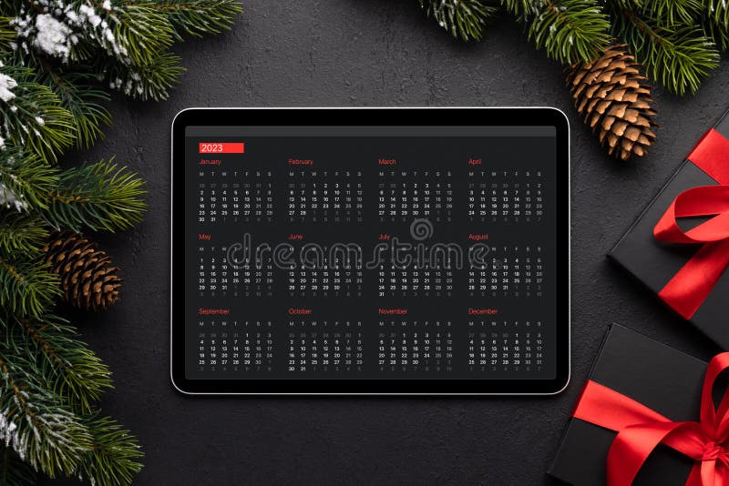 Tablet with Calendar, Gift Boxes and Christmas Decor Stock Image ...