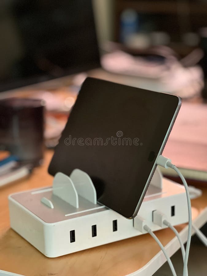 Tablet Charging in Multi-Device Dock—Modern Workspace Organization ...