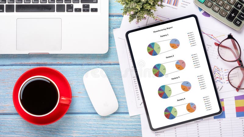 Tablet with Charts and Reports, Calculator, Pen, Notebook and Coffee on ...