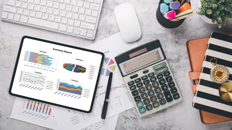 Tablet with Charts and Reports, Pen, Calculator, Notebook, Mouse and ...