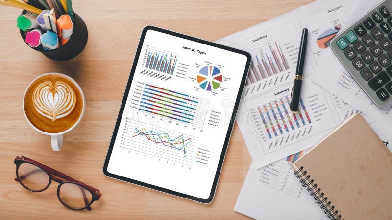 Tablet with Charts and Reports, Pen, Calculator, Notebook, Mouse and ...