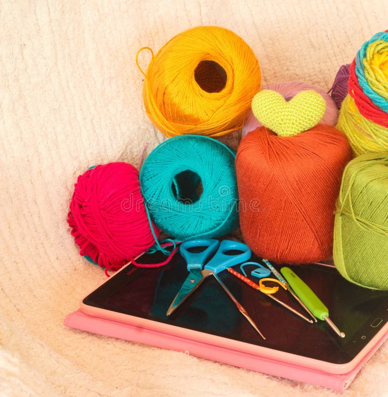 Tablet with Colored Threads and Wool and Crochet Needles for Online ...
