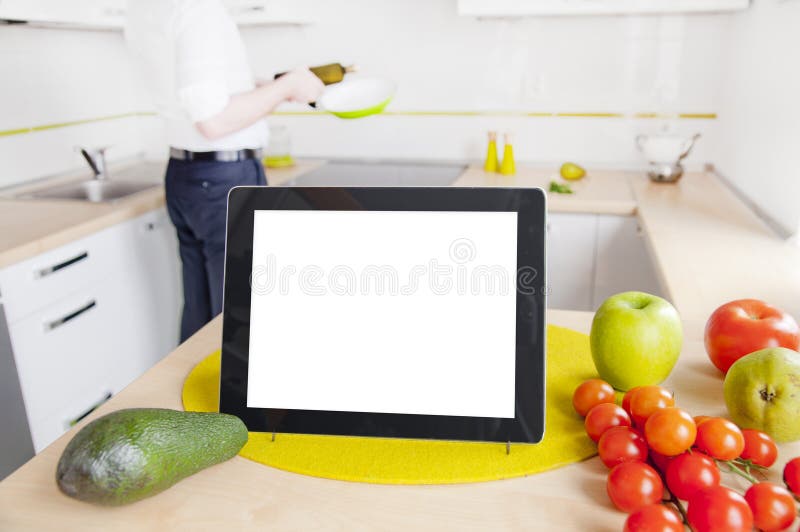 Tablet Computer with Blank Screen in the Kitchen Stock Photo - Image of ...