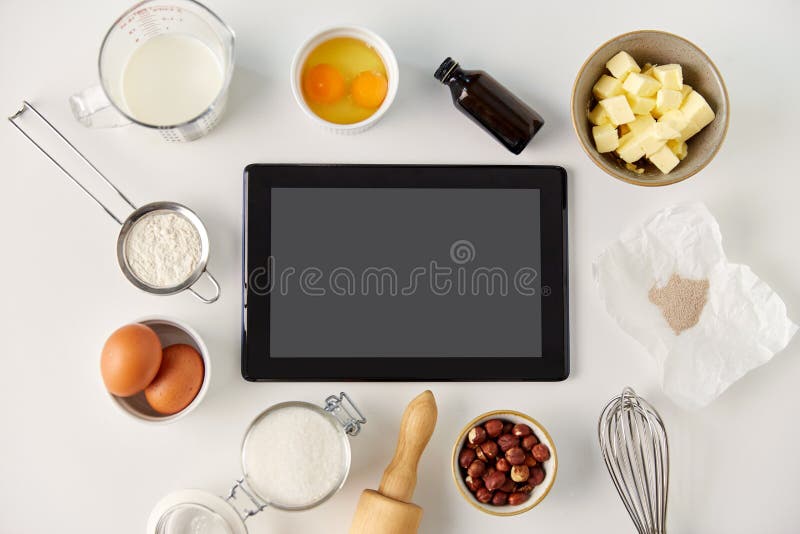 Tablet Computer and Cooking Ingredients on Table Stock Image - Image of ...