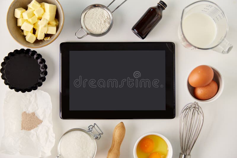 Tablet Computer and Cooking Ingredients on Table Stock Image - Image of ...