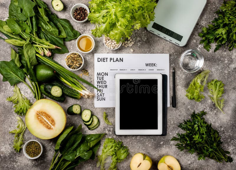 Tablet Computer Diet Plan Kitchen Scale and Set of Healthy Food on the ...