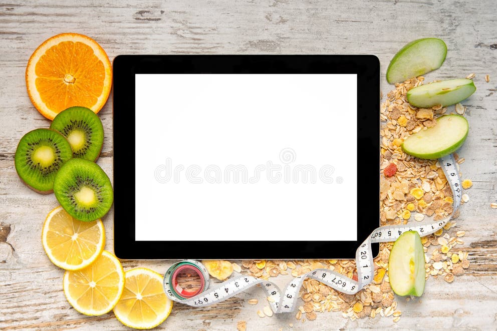 Tablet Computer with Fruit and a Measuring Tape for Weight Loss Stock ...