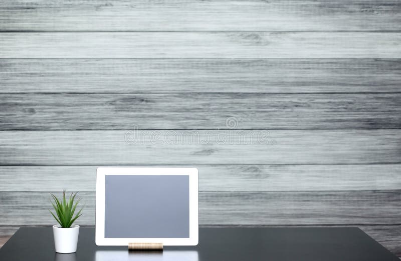 Tablet Computer, Home Plant on the Table. Work at Home. Gadgets ...