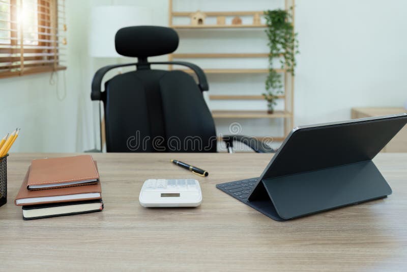 Tablet Computer, Notebook, Calculator and Coffee Cup on the Desk in the ...