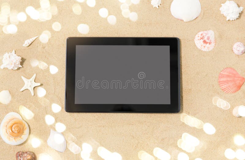 Tablet Computer and Seashells on Beach Sand Stock Image - Image of ...