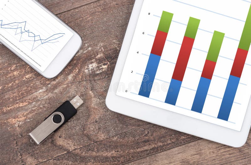 Tablet Computer and Smartphone with Statistics Charts Stock Photo ...