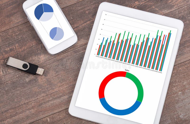 Tablet Computer and Smartphone with Statistics Charts Stock Image ...