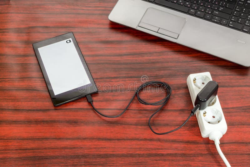 Tablet Connected To a Power Outlet. Stock Image - Image of information ...