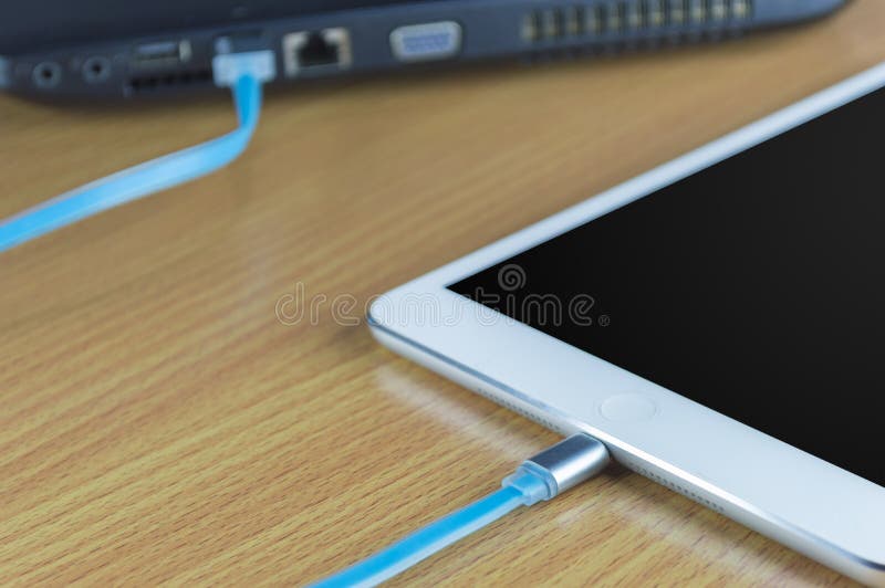 Tablet is Connecting To Laptop Computer Stock Photo - Image of phone ...