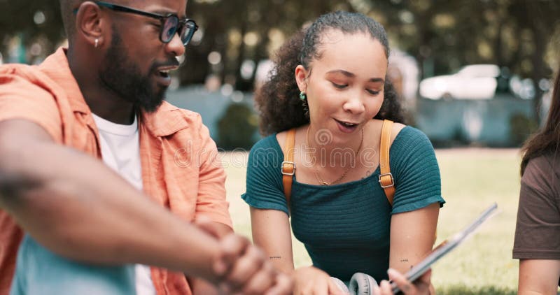 Tablet, Conversation and Students Studying on Grass in Outdoor Park for ...