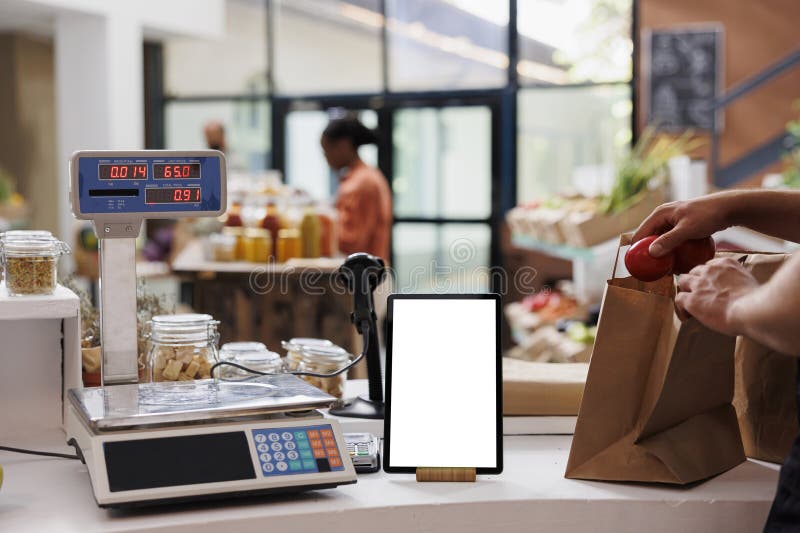 Tablet on a Counter in Grocery Store Stock Photo - Image of counter ...
