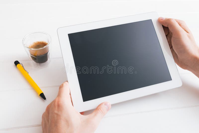 Tablet Device Over a White Wooden Workspace Table Stock Image - Image ...
