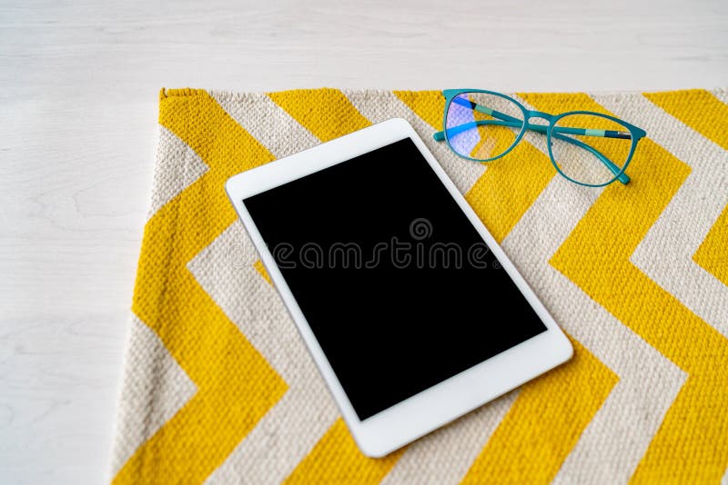 Tablet on Dining Table with Reading Glasses - Blue Light Protection ...