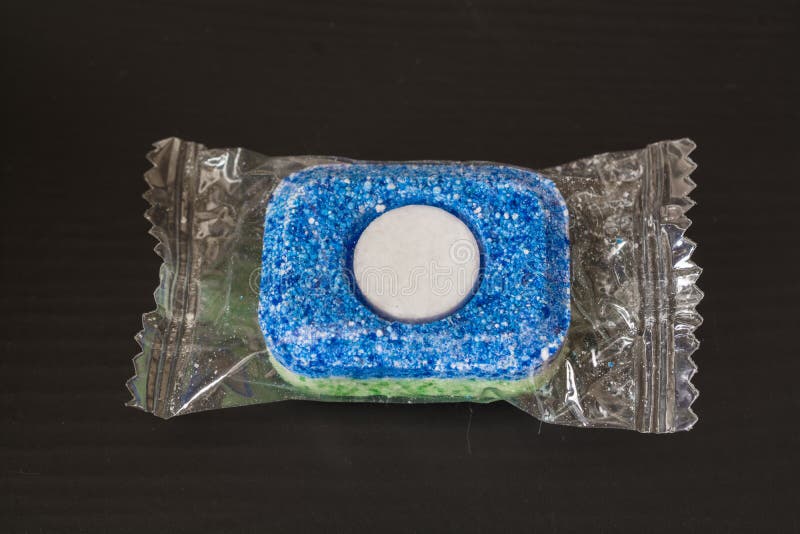 Tablet for Dishwashing Machine on a Black Background. Stock Image ...