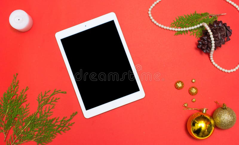 Tablet Display on Table on Red Screen for Mockup in Christmas Time ...