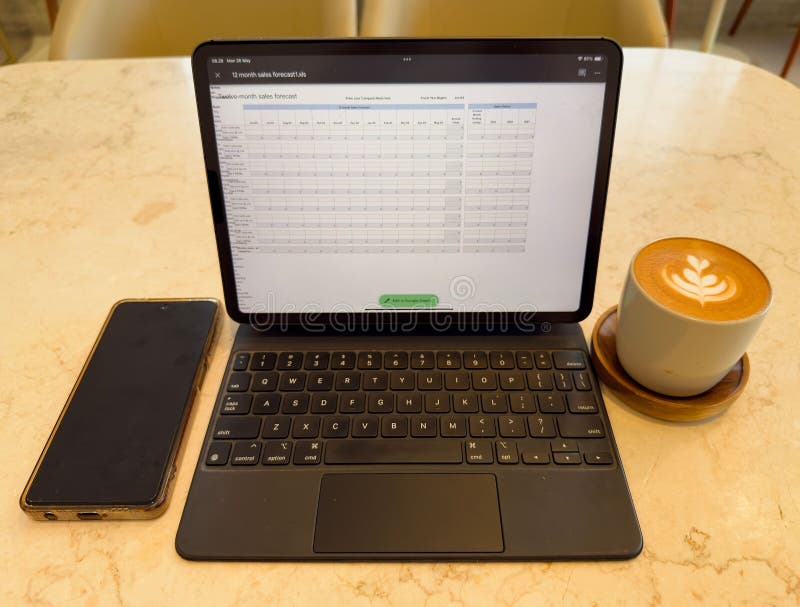Tablet with Sales Forecast and Coffee on Table. Stock Image - Image of ...