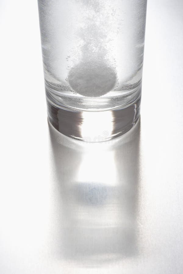 Tablet Dissolving in Glass of Water Stock Image - Image of white ...