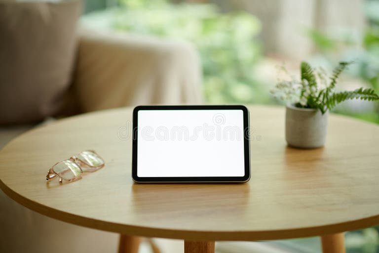 Tablet on Coffee Table stock image. Image of video, online - 299592761