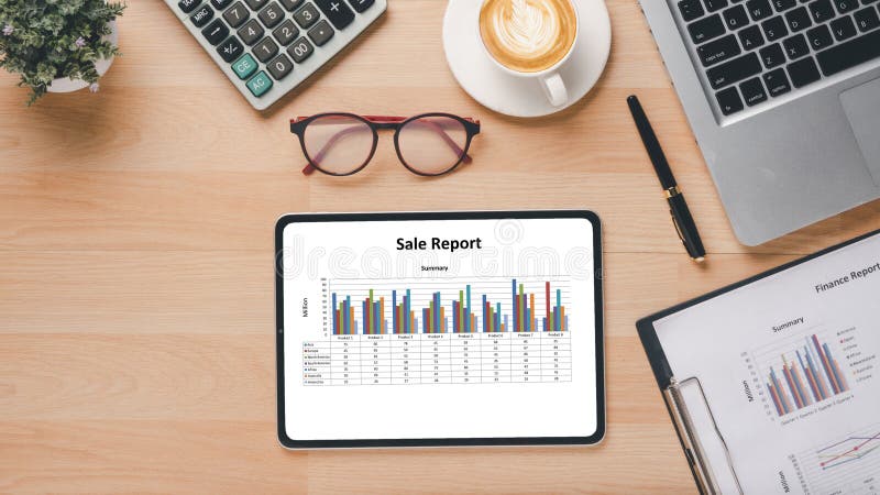 Tablet with Financial Charts and Reports on Office Desk Workplace ...