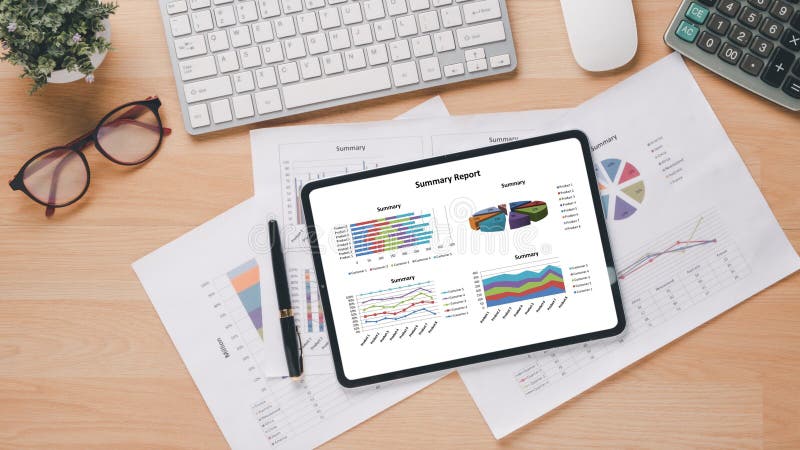 Tablet with Financial Charts and Reports on Office Desk Workplace ...