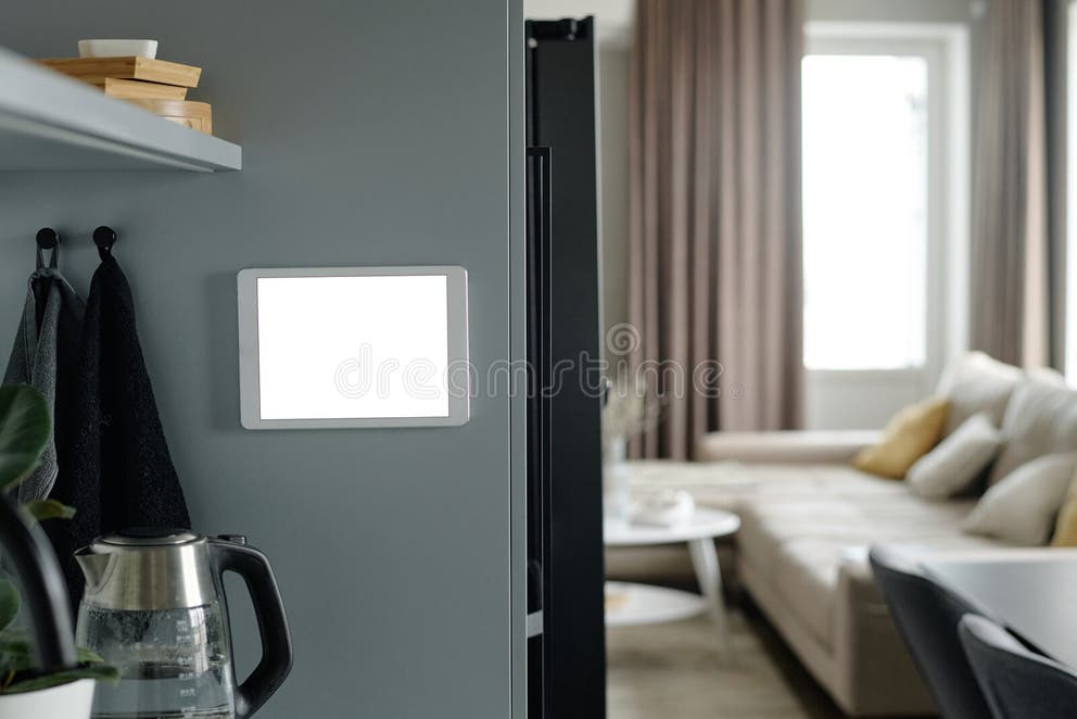 Tablet on Fridge in Kitchen Stock Image - Image of screen, studio ...