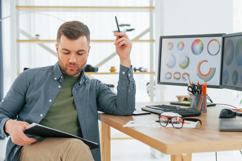 With Tablet in Hands. Male Designer Working in the Office by Using PC ...