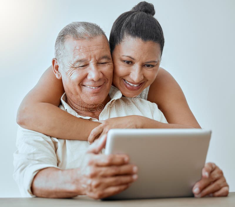 Tablet, Internet and Love with a Senior Couple Browsing Online Using ...